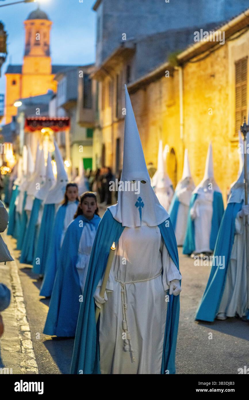 Hooded brothers with conical hats that serve as masks, Holy Week ...