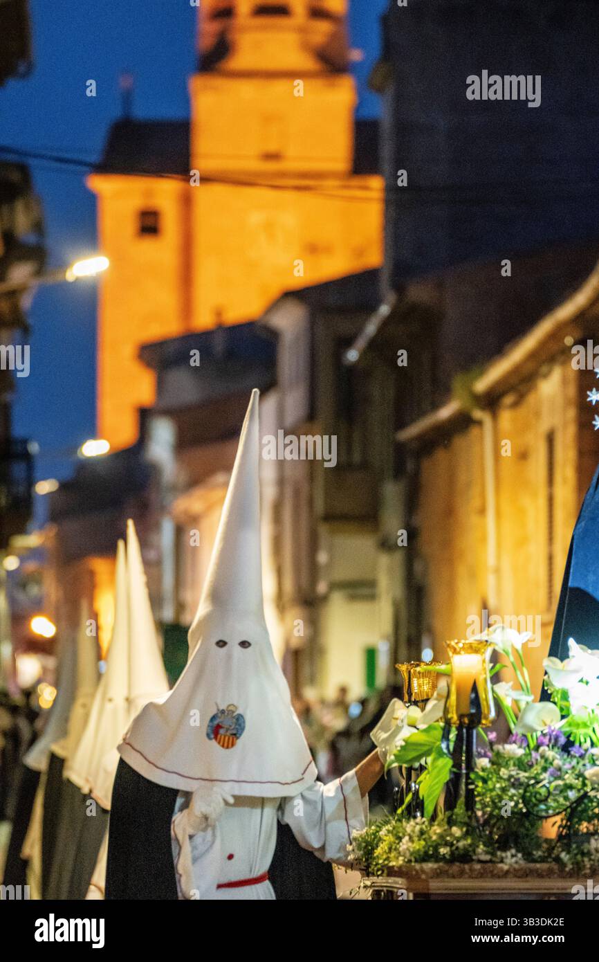 Hooded brothers with conical hats that serve as masks, Holy Week ...