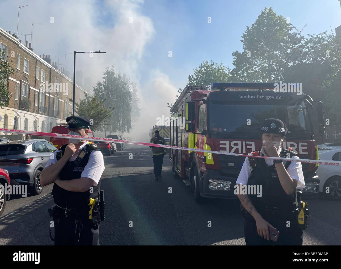 Emergency services at the scene of a fire at an electrical substation ...
