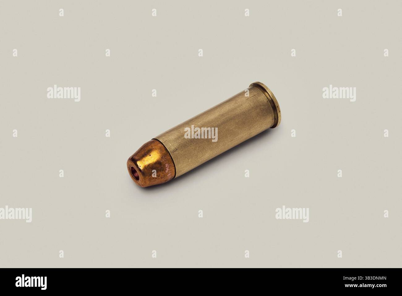 Still life of .44 Magnum bullet cartridge laying on white background ...