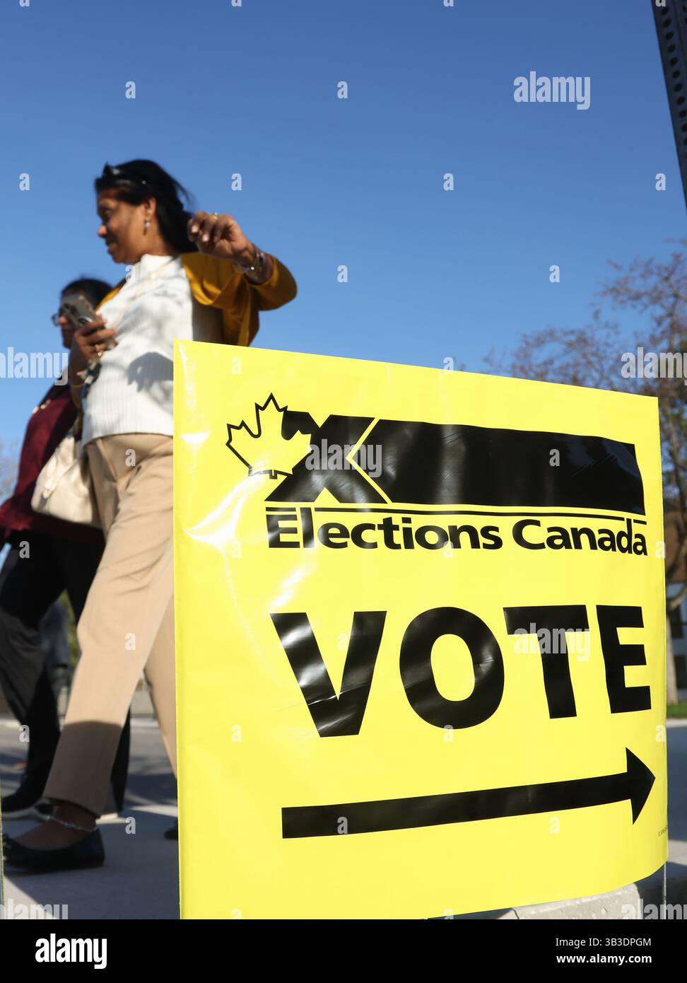 Toronto, Canada.28th April 2025. A vote sign is seen as people leave a ...