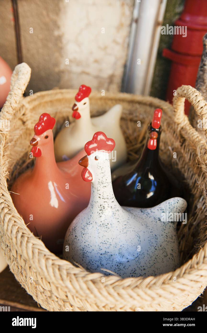 Basket with stone chicken in a basket at the market Stock Photo - Alamy