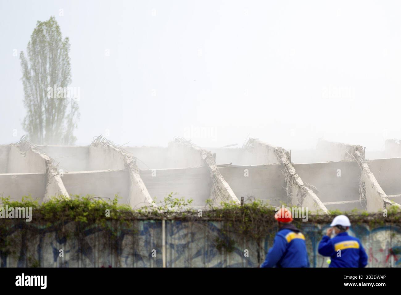 Old building demolition by controlled implosion using explosives ...