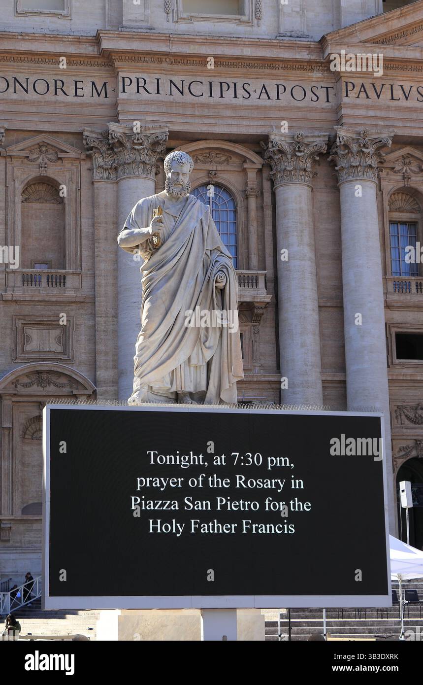 St. Peter's statue with electronic screen annnouncing the recitation of ...