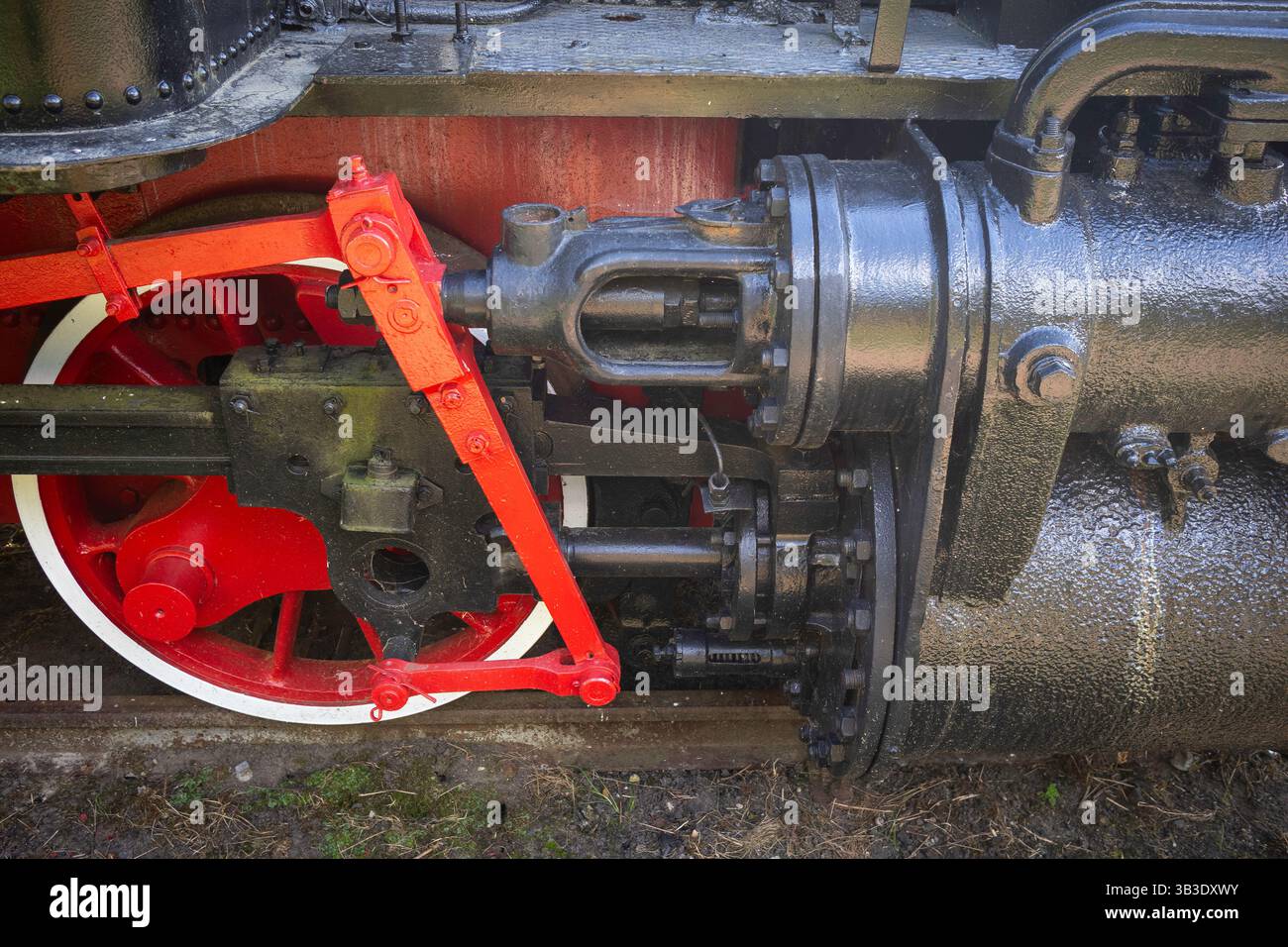 A train engine with a red and white wheel is shown. Concept of ...