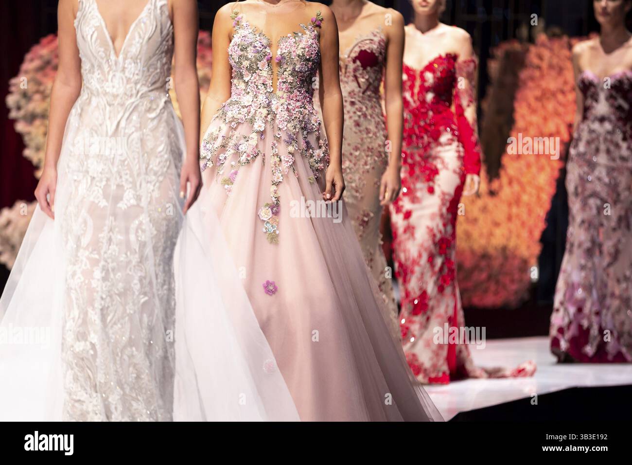 Female models walk the runway in different dresses during a Fashion ...