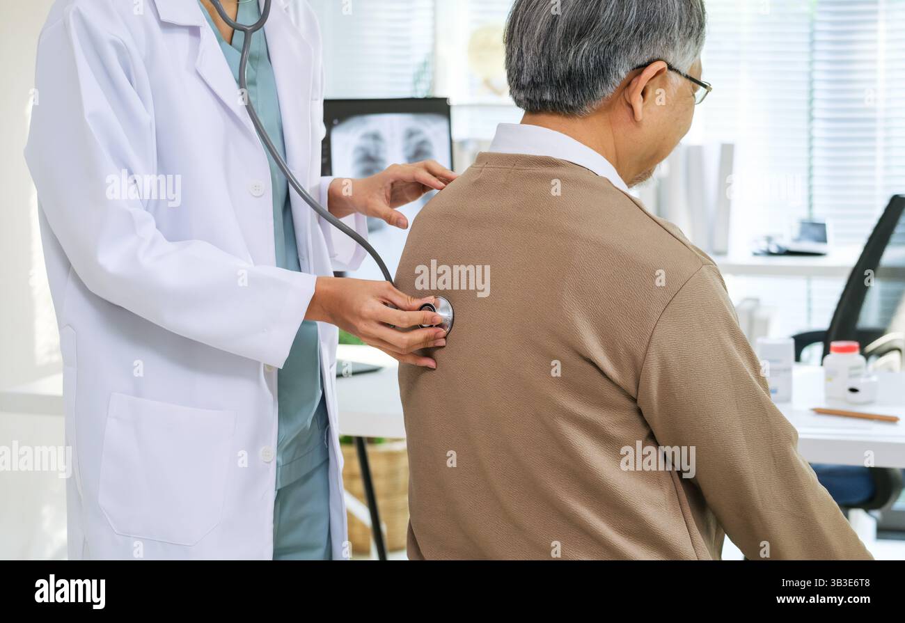Doctor Using Stethoscope to Check Senior Patient's cardiology and ...