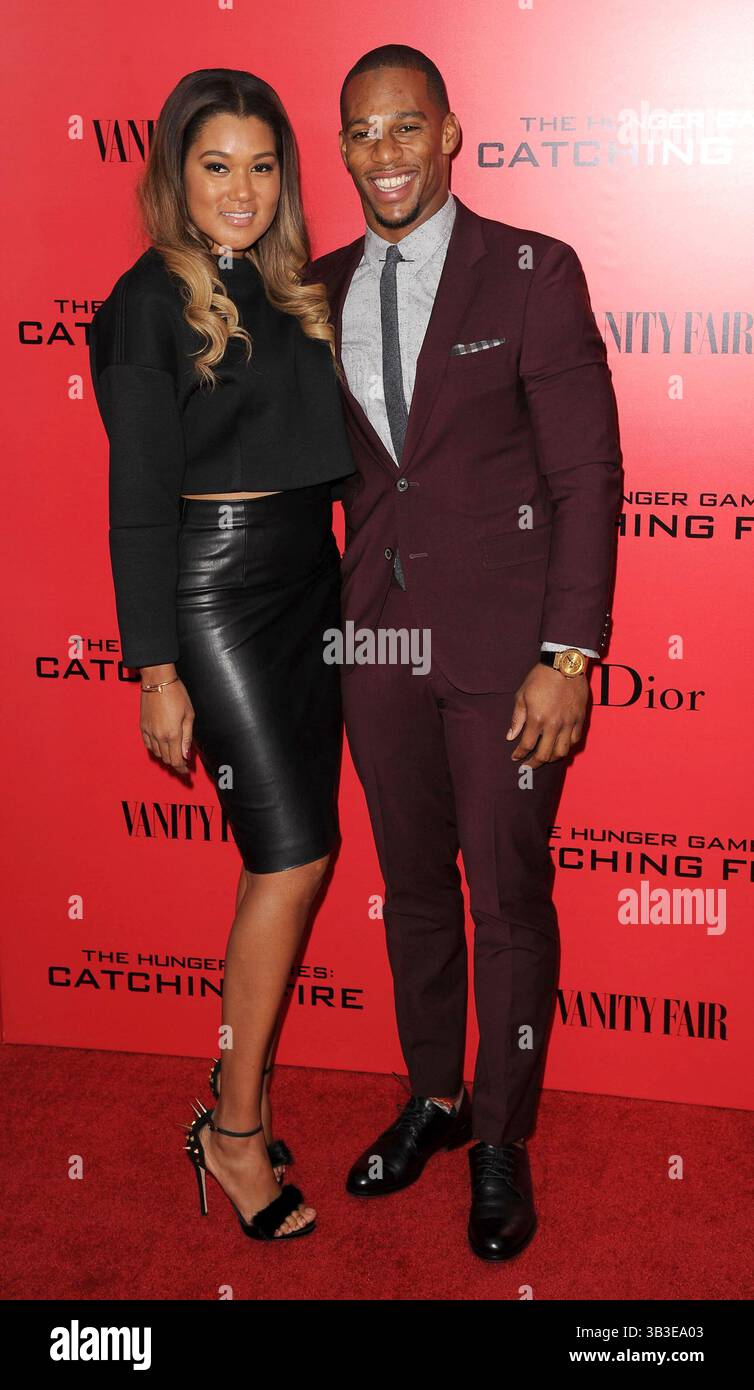 Elaina Watley and Victor Cruz at the premiere of 'The Hunger Games ...