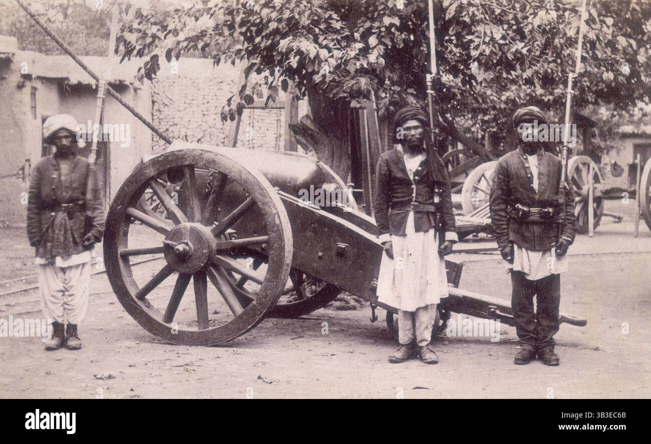 Three Afghan soldiers standing next to a cannon, Afghanistan, 1880s ...