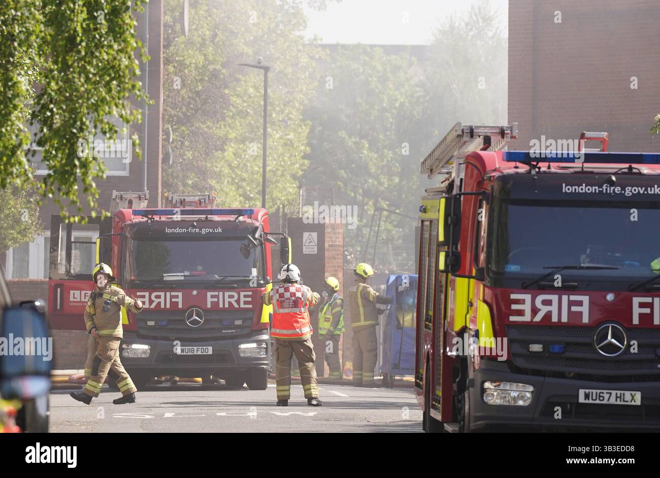 Emergency services at the scene of a fire at an electrical substation ...