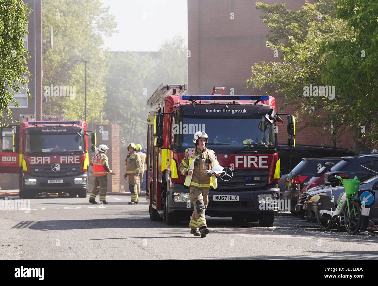 Emergency services at the scene of a fire at an electrical substation ...