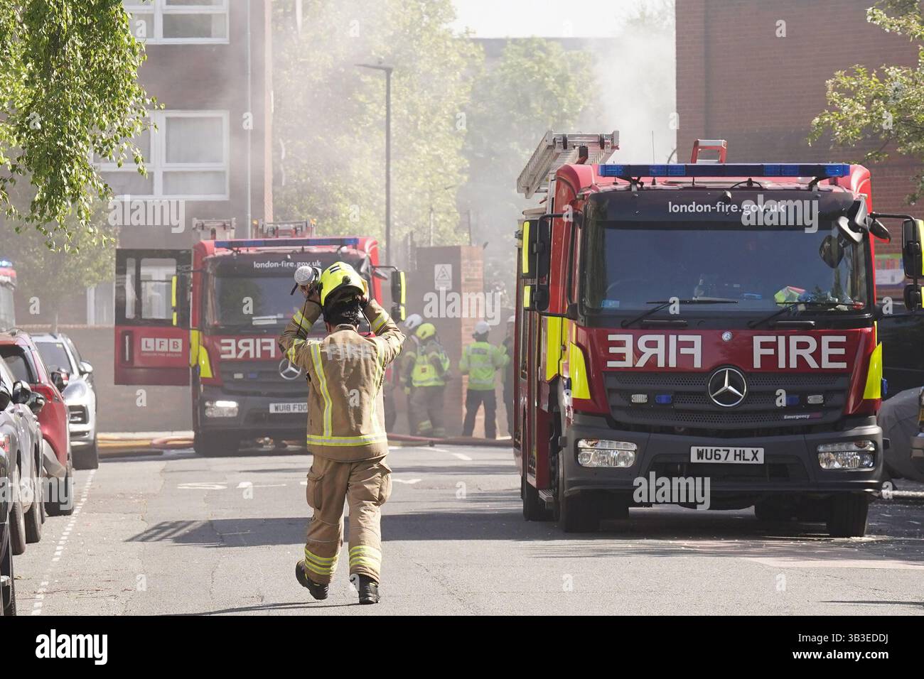Emergency services at the scene of a fire at an electrical substation ...
