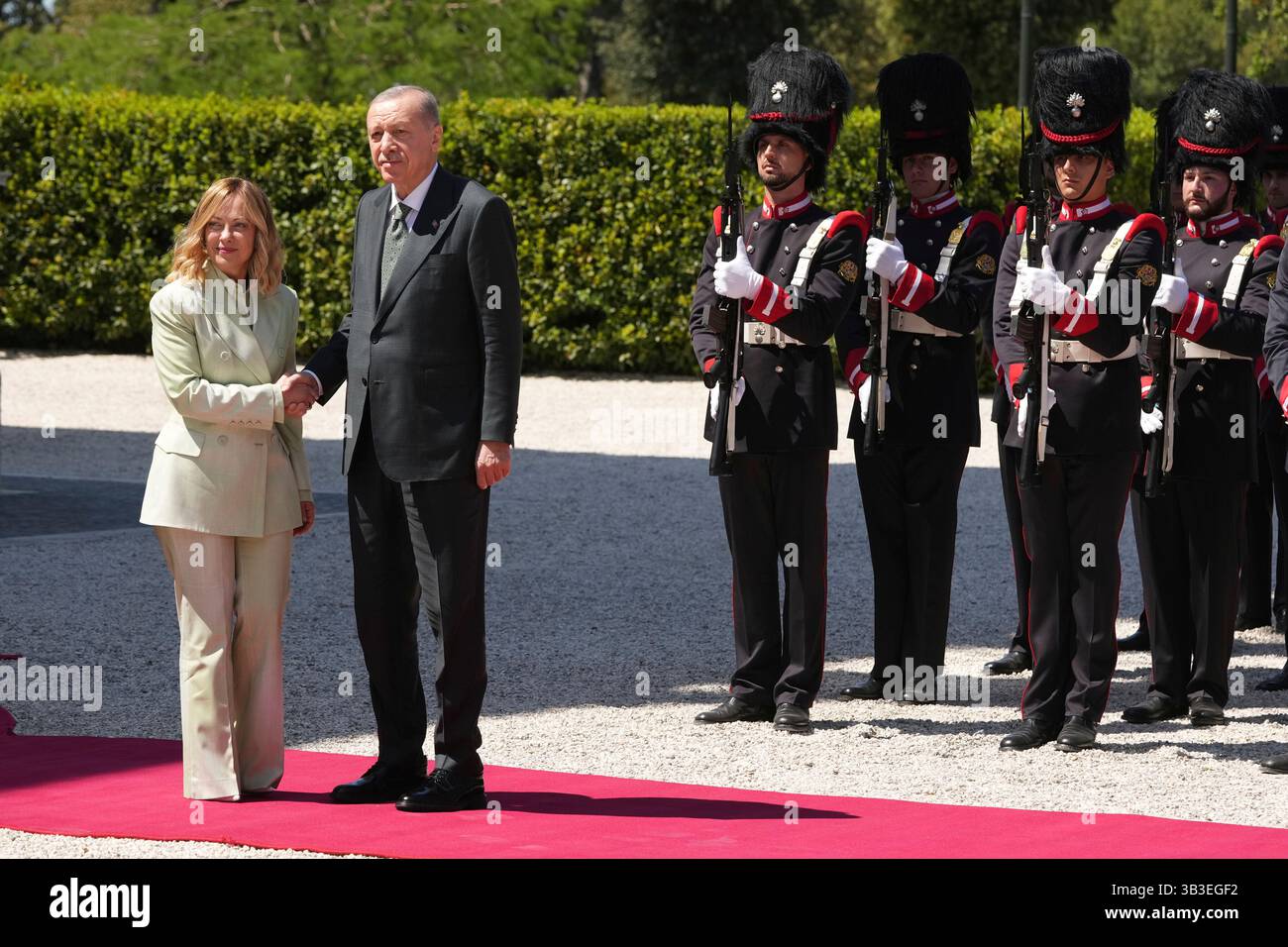 Turkey's President Recep Tayyip Erdogan, right, shakes hands with ...