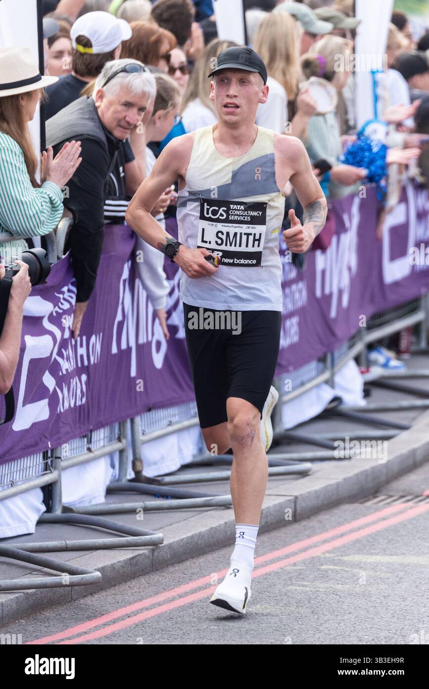 Logan Smith, elite male athlete competing in the 2025 TCS London Marathon, passing through Tower ...