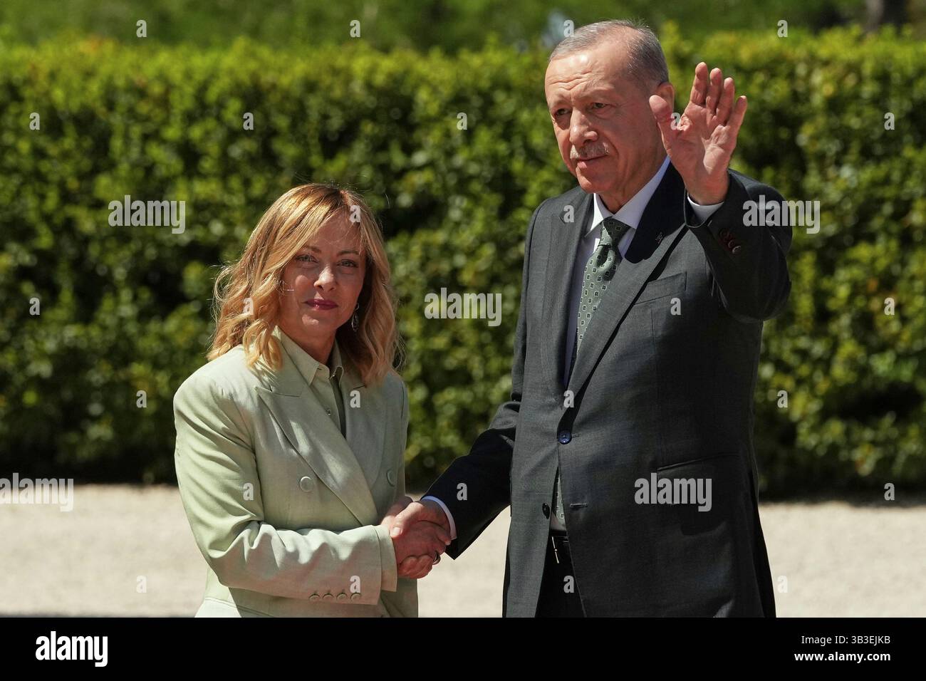 Turkey's President Recep Tayyip Erdogan, right, shakes hands with ...