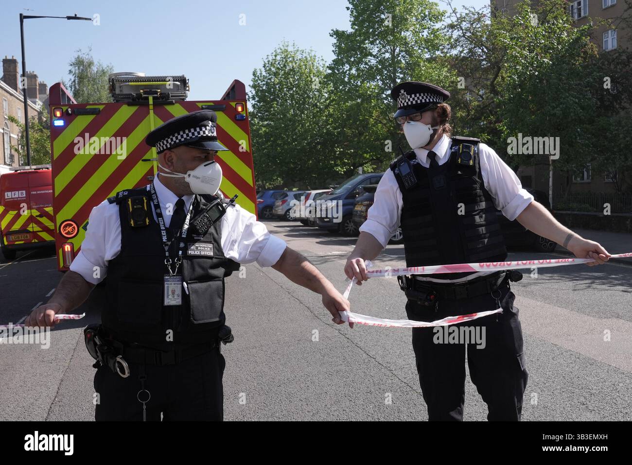 Emergency services at the scene of a fire at an electrical substation ...