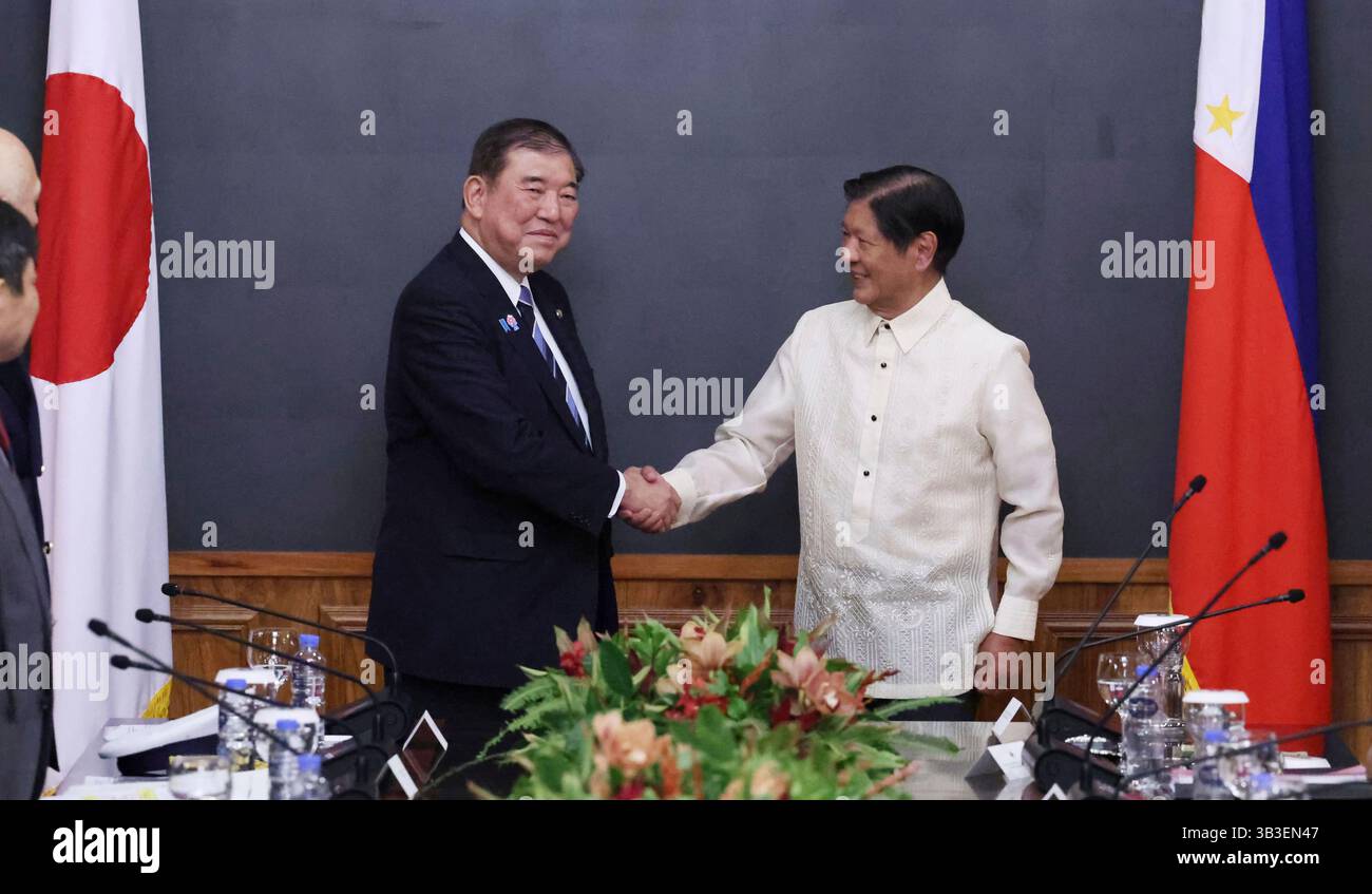 Japanese Prime Minister Shigeru Ishiba (L) and Philippine President ...