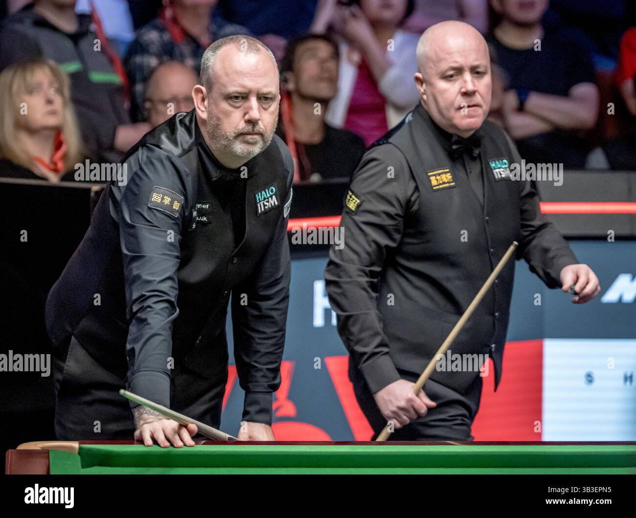 Mark Williams (left) and John Higgins (right) during their match, on ...