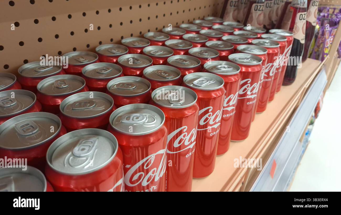 Moscow, Russia - April 26, 2025.Rows of coca-cola cans on store shelf ...