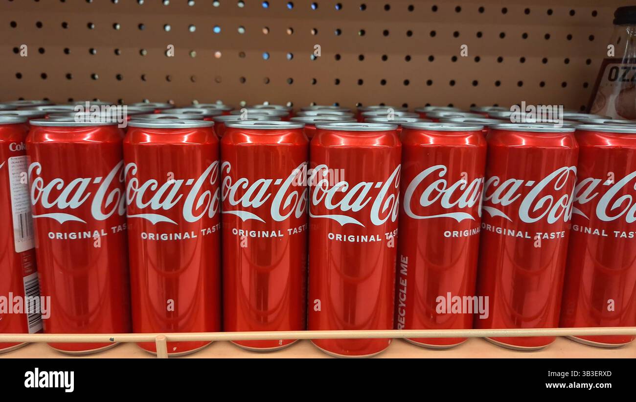 Moscow, Russia - April 26, 2025.Coca-cola cans displayed on shelf - red ...