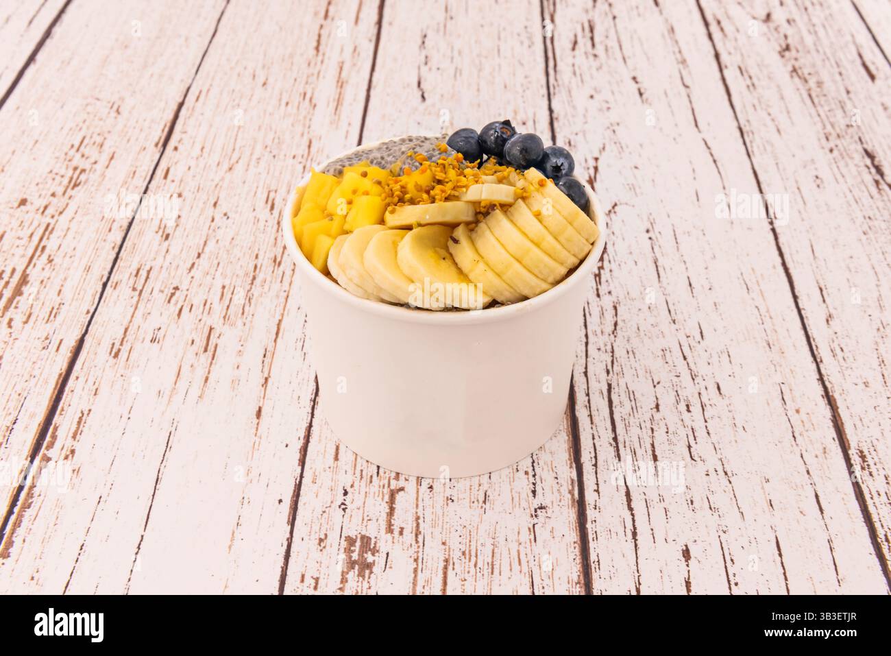Acai in a pot is a typical Brazilian dish made from frozen and crushed ...