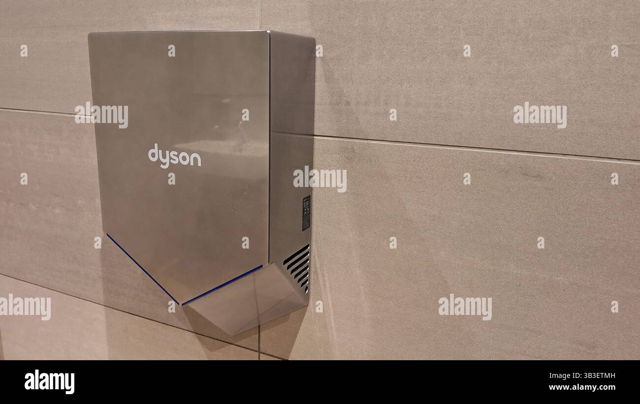 Moscow, Russia - April 26, 2025.Dyson hand dryer on beige tiled wall ...