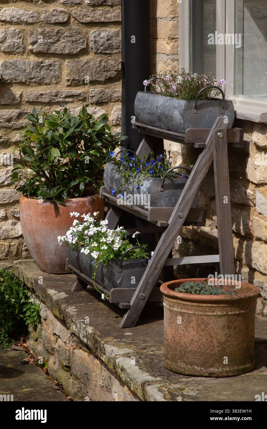 wooden pot display stand in English Garden, England Stock Photo - Alamy