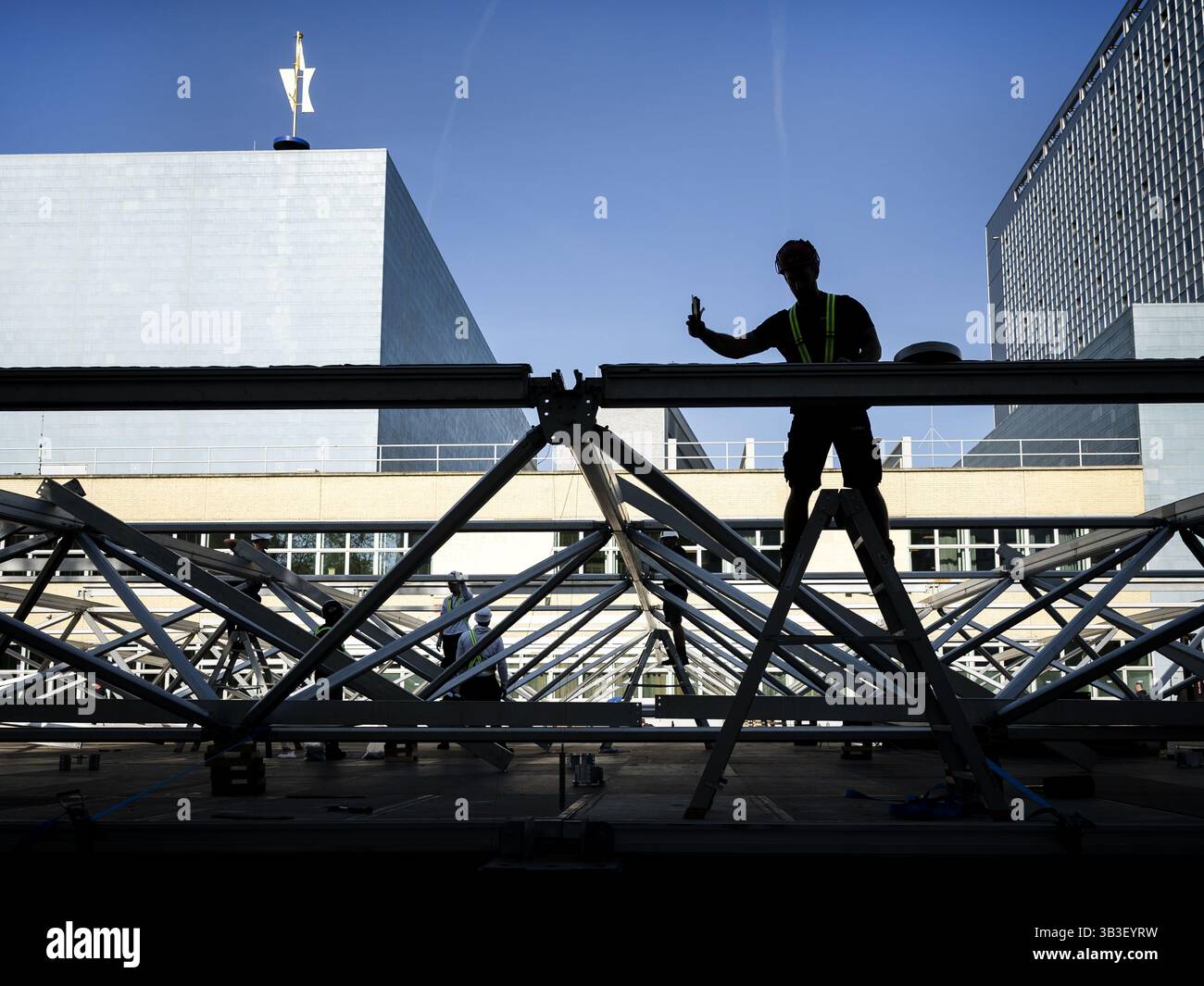 THE HAGUE - Work on a roof structure at the World Forum. The event ...