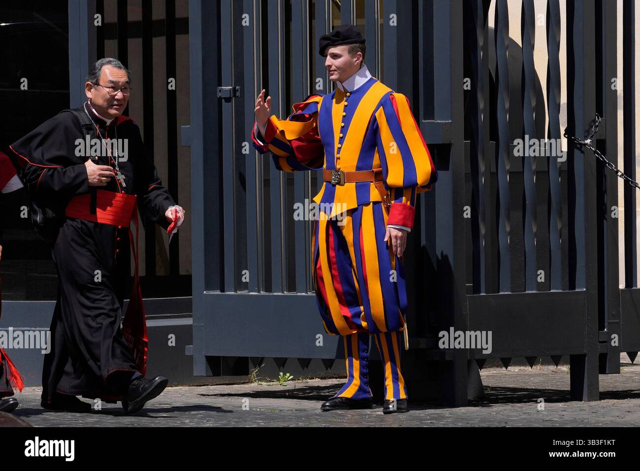 Cardinal Tarcisio Isao Kikuchi leaves at the end of a college of ...