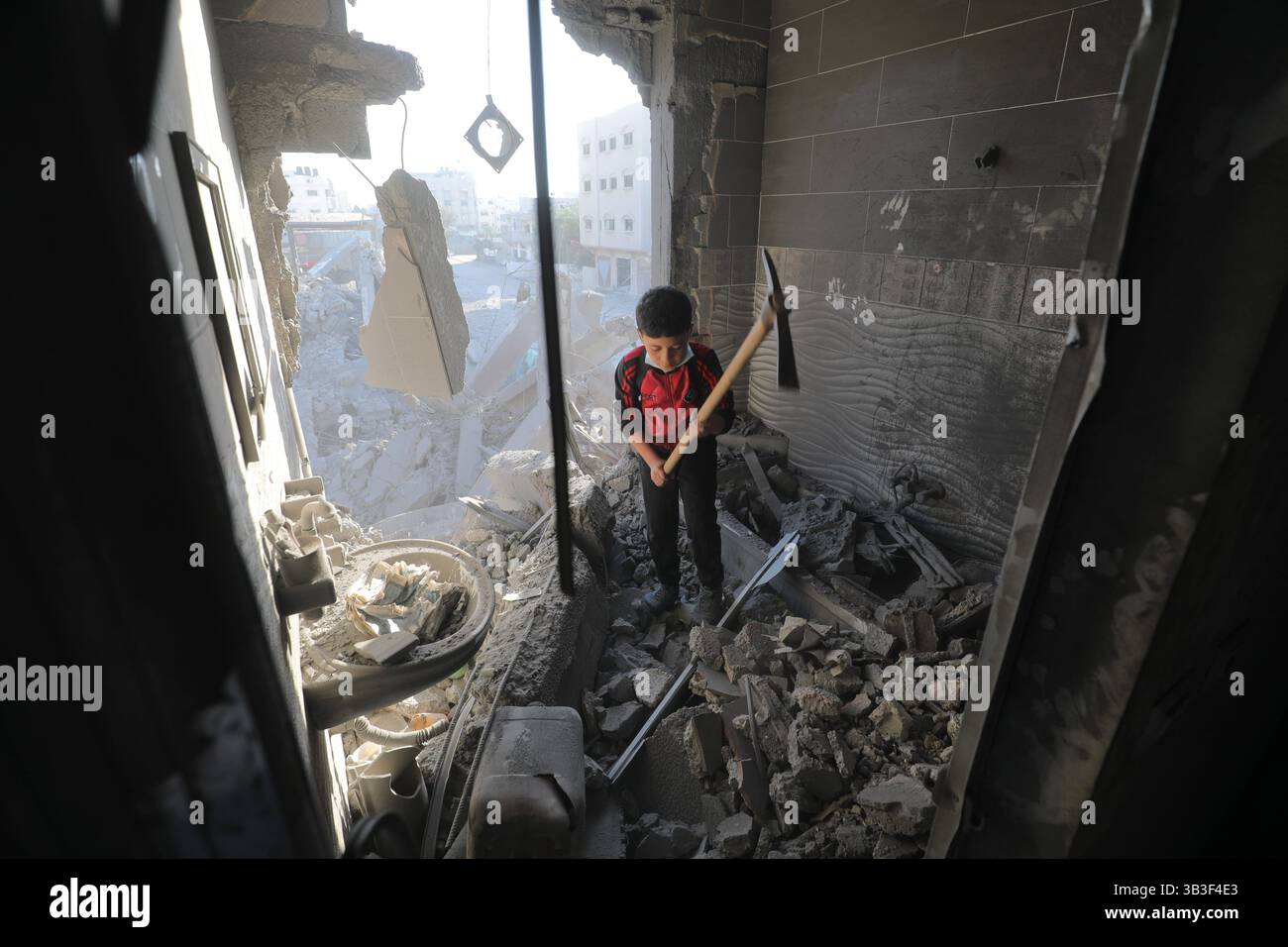 Palestinians inspect the damage, following overnight Israeli strikes ...
