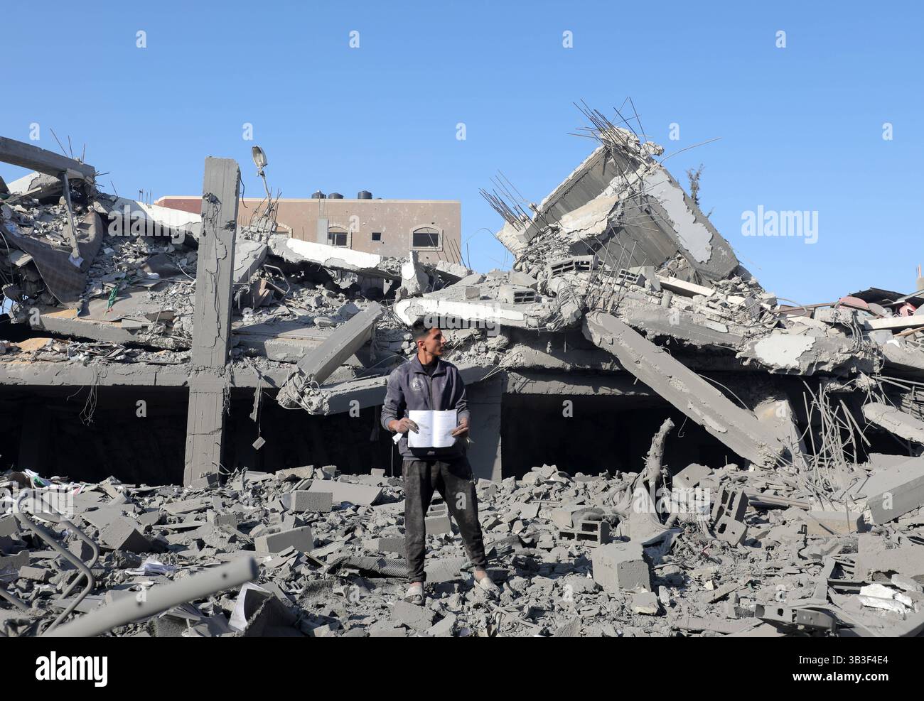 Palestinians inspect the damage, following overnight Israeli strikes ...
