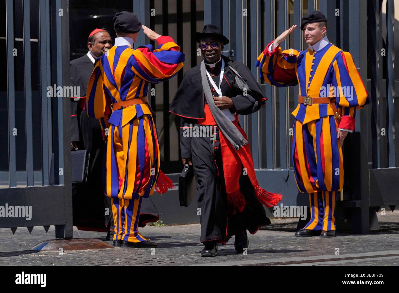 Cardinal Ignace Bessi Dogbo, of Ivory Coast, leaves at the end of a ...