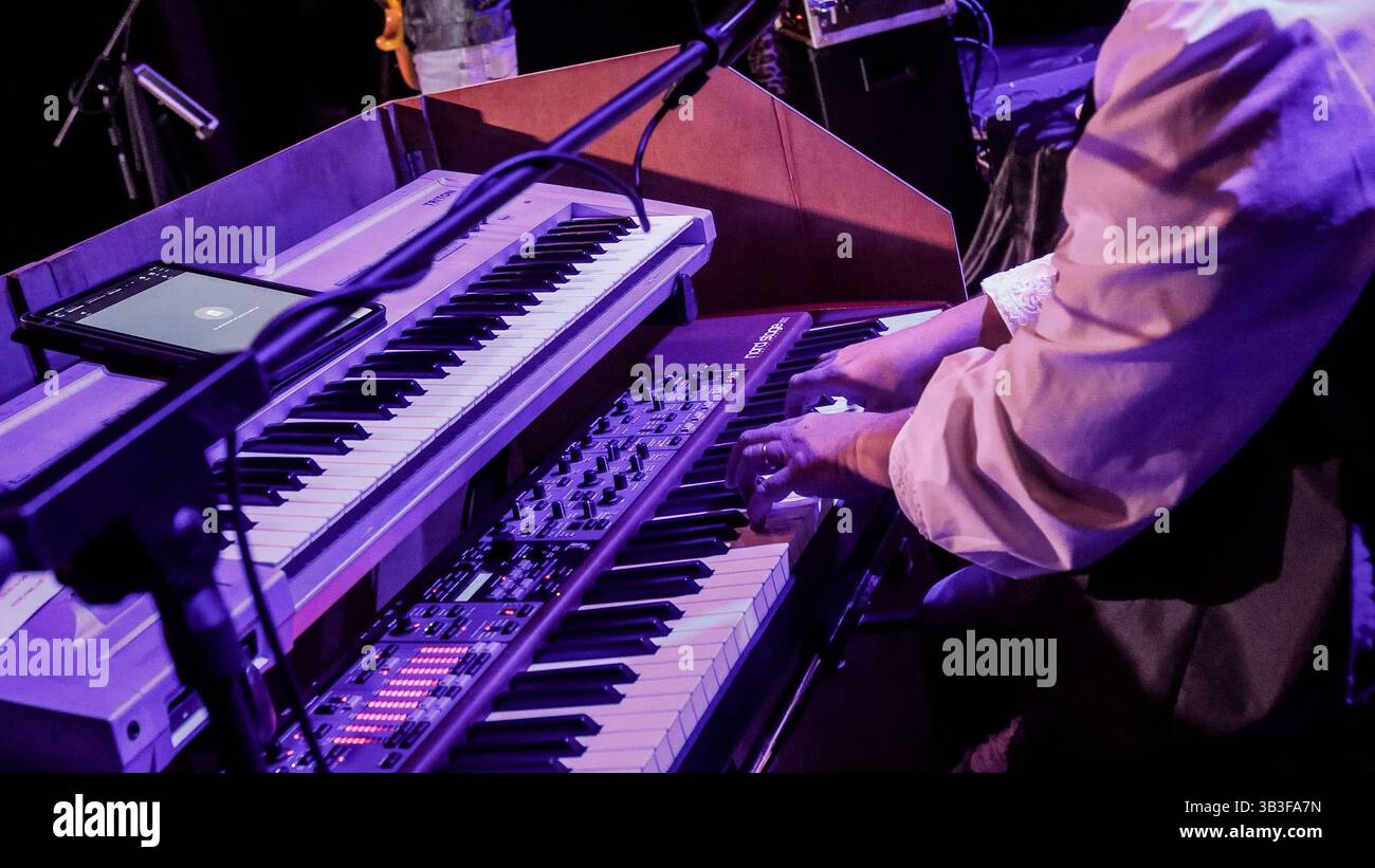 Milan, italy 2 april 2025: close-up of musician's hands playing ...