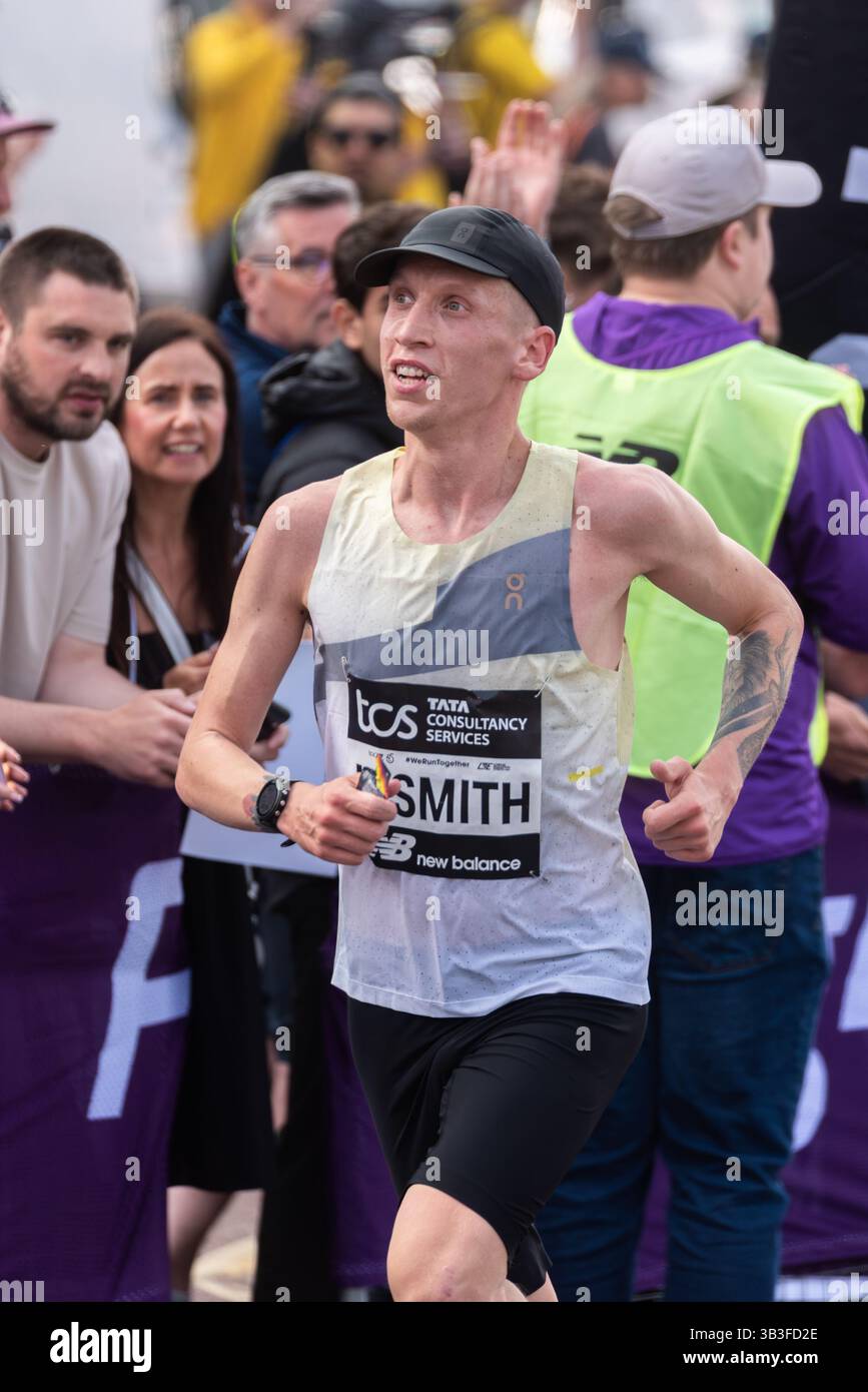 Logan Smith, elite male athlete competing in the 2025 TCS London Marathon, passing through Tower ...