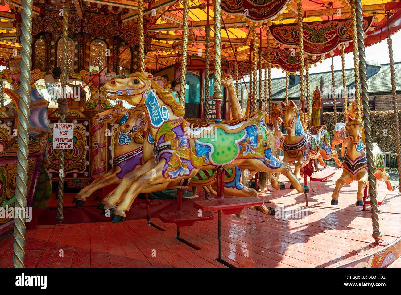 Carousel with colorful horses at amusement park, Merry go round with ...