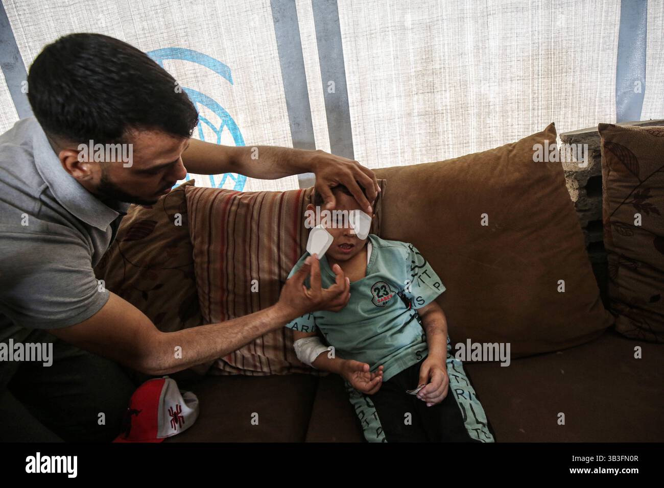 A Palestinian child, Mohammad Hijazi 7 years old, is receiving care ...