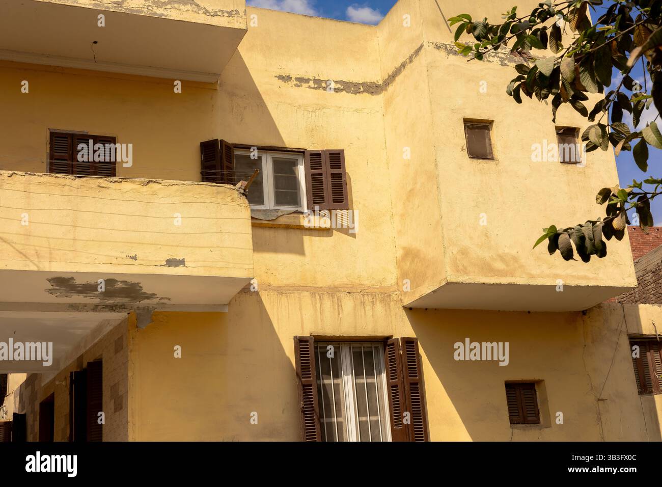 Old Residential Building in Egypt with Yellow Walls and Brown Window ...