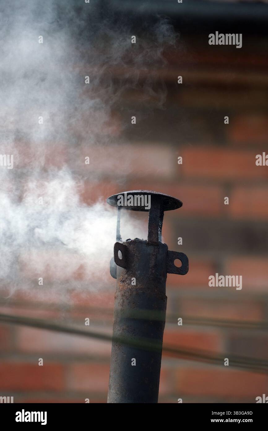 Smoke from chimney of outdoor fast food kitchen at an event Stock Photo ...