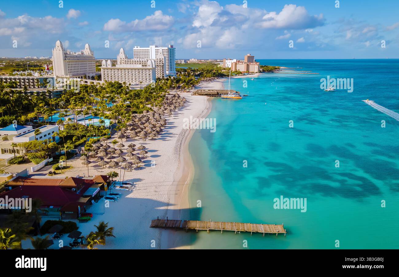 Discover the breathtaking views of Palm Beach in Aruba, where soft ...