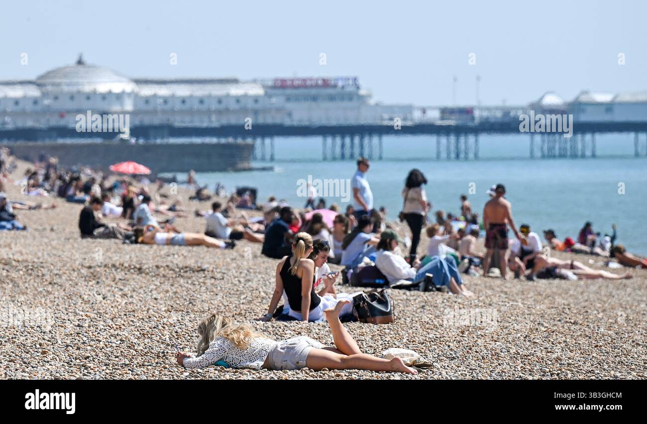 Brighton UK 29th April 2025 - Visitors enjoy the hot sunny weather on ...
