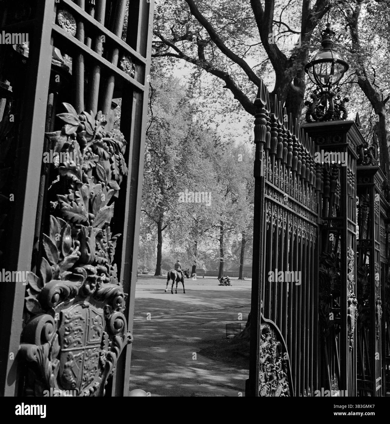 A view through one of the five pairs of elaborate cast iron gates at ...