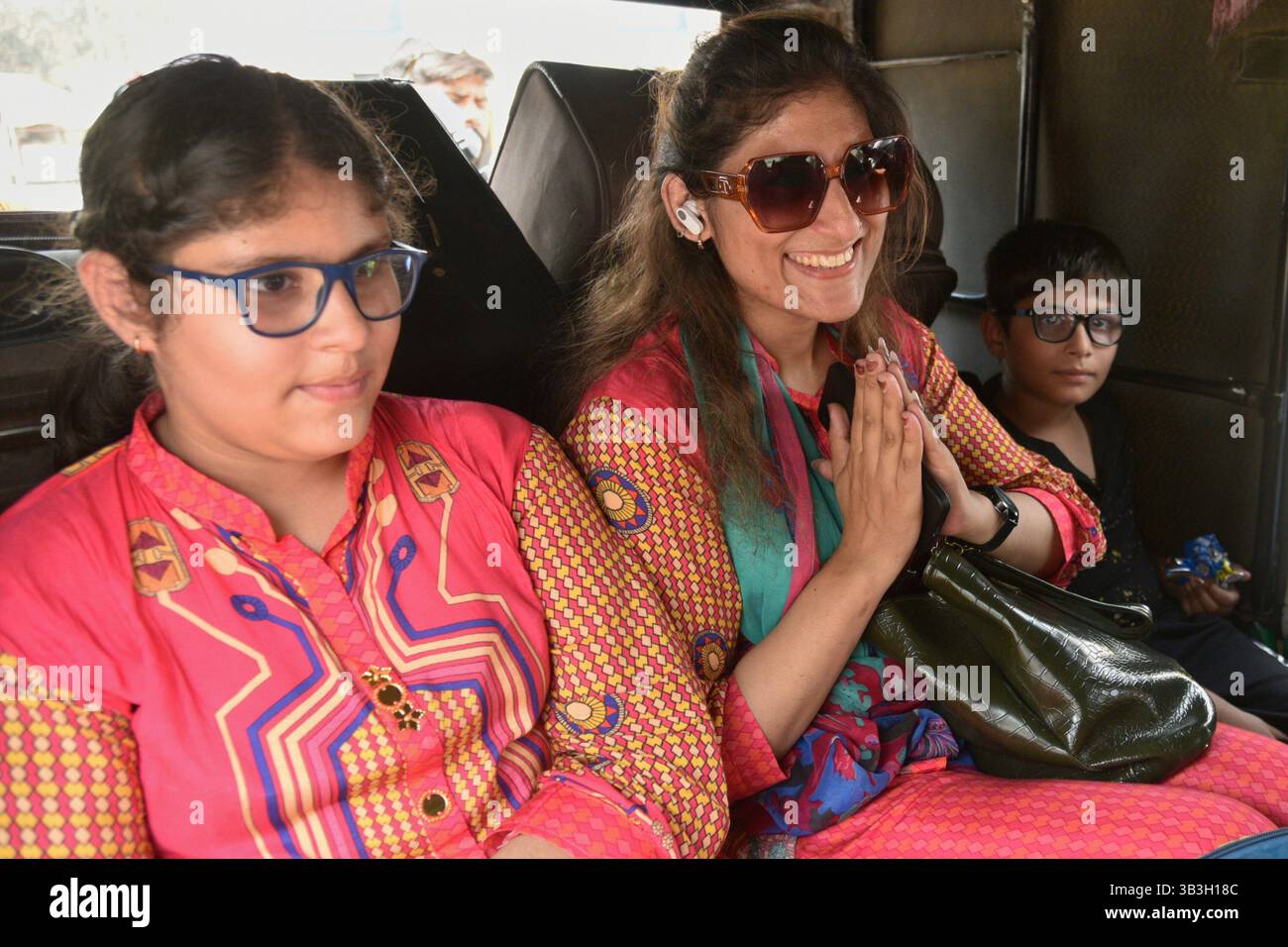 Pakistani national Savita Kumari, center, flanked by her Indian ...