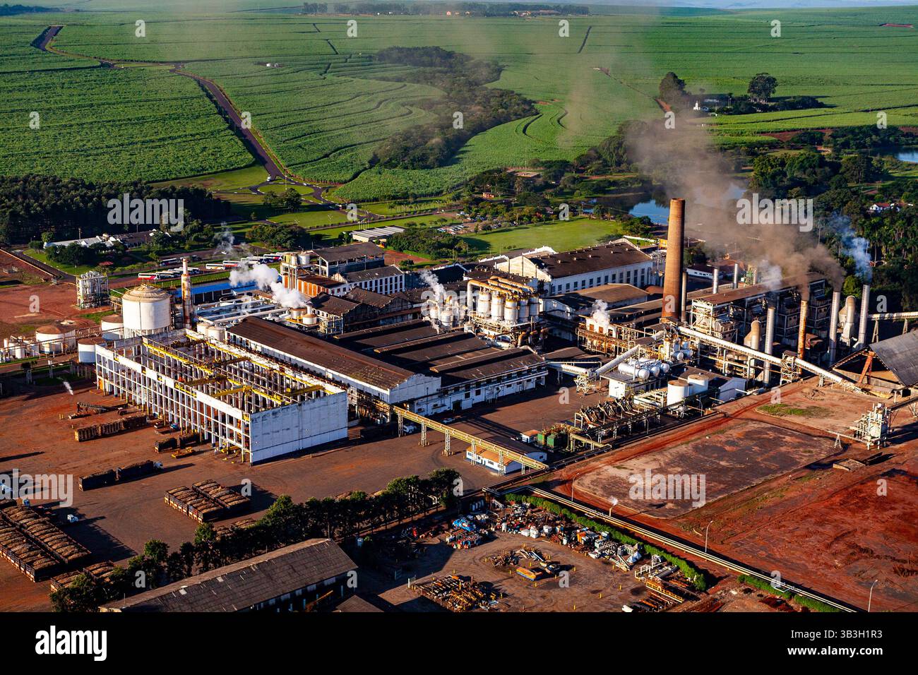 Aerial view of the São Martinho industrial complex, trucks loaded with ...