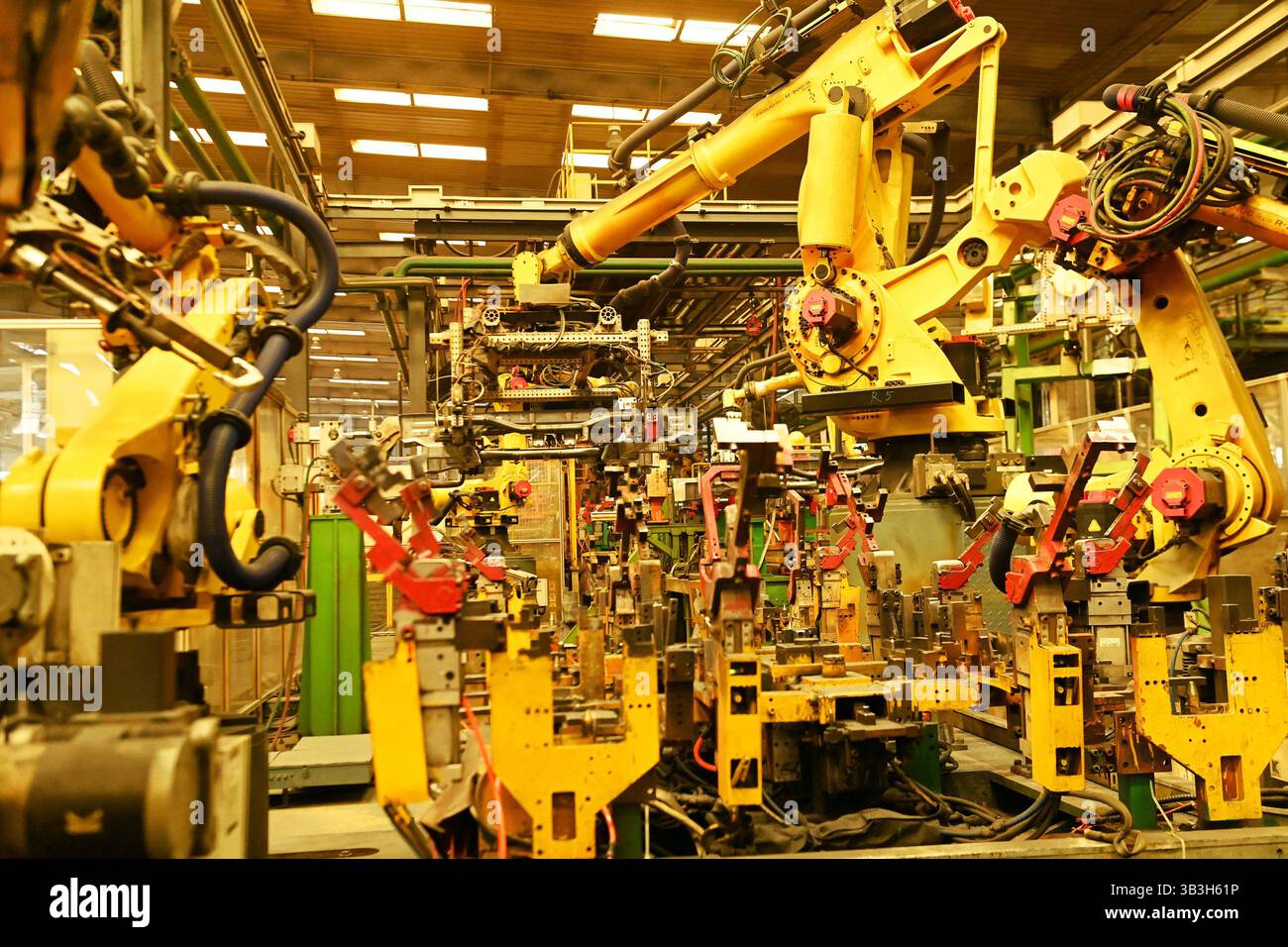 QINGDAO, CHINA - APRIL 24, 2025 - Mechanical arms are manufacturing ...