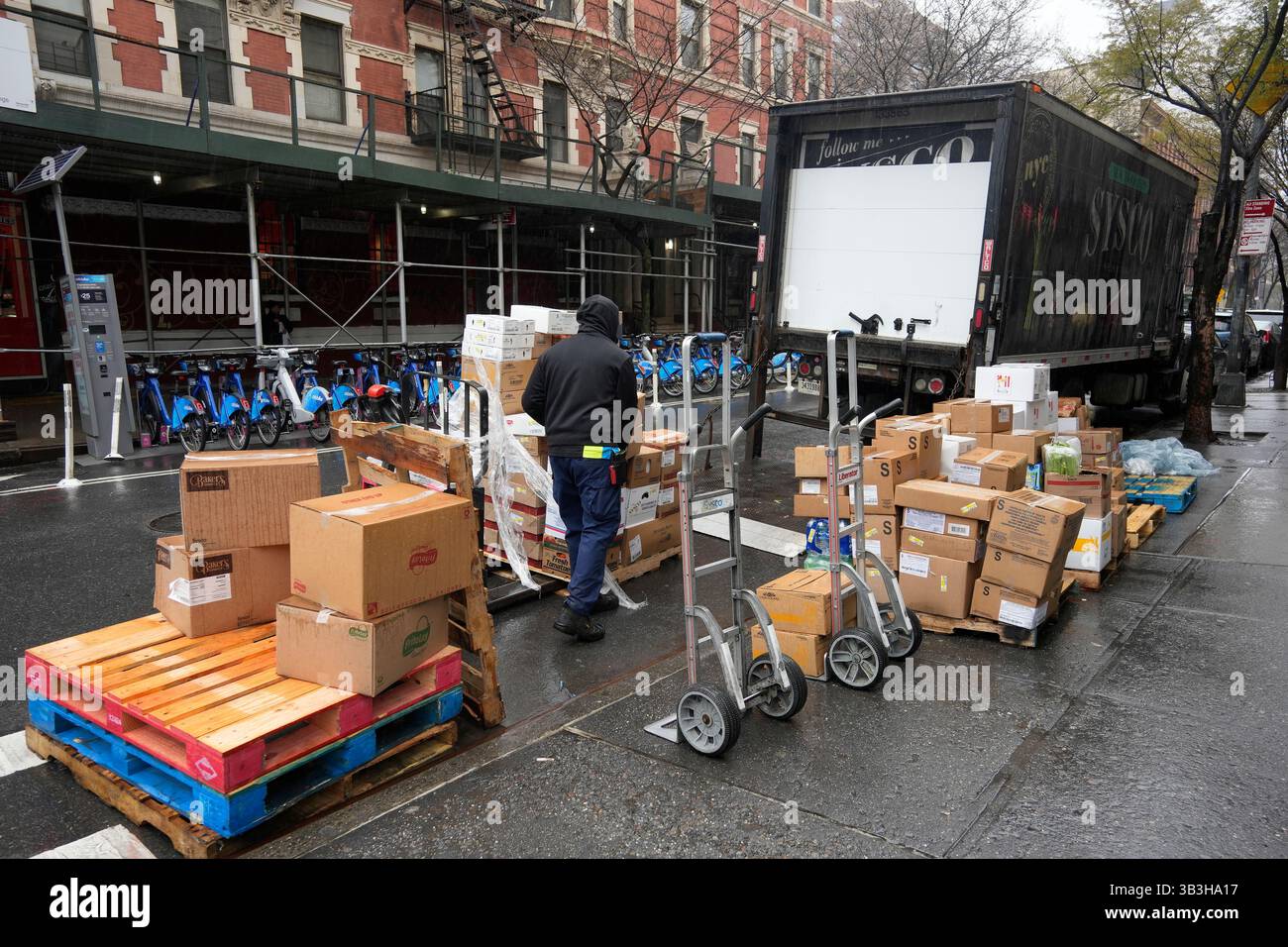 Pallets loaded with deliveries for a grocery in the Chelsea ...