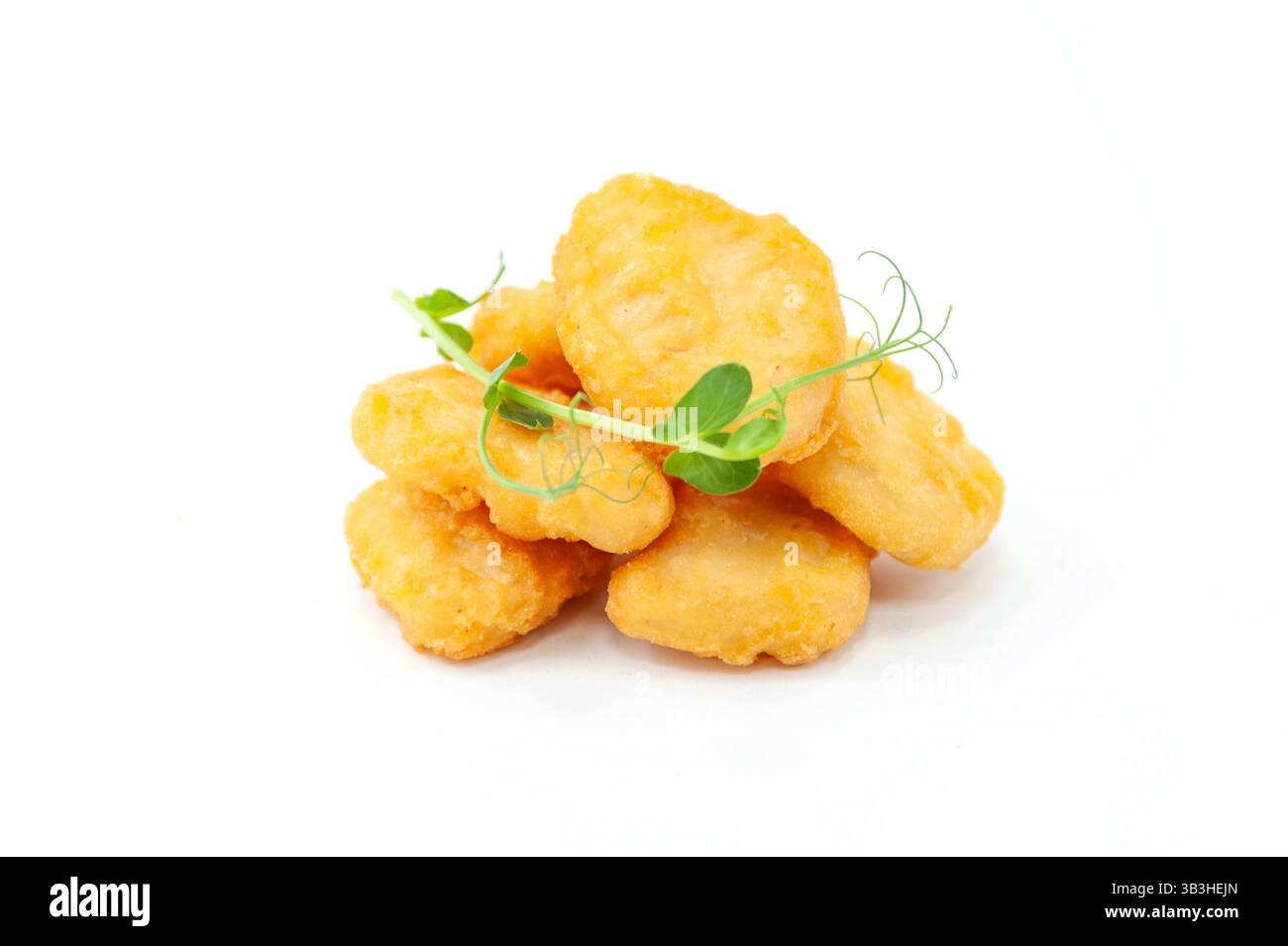 Crispy Chicken Nuggets with Fresh Microgreens Stock Photo - Alamy