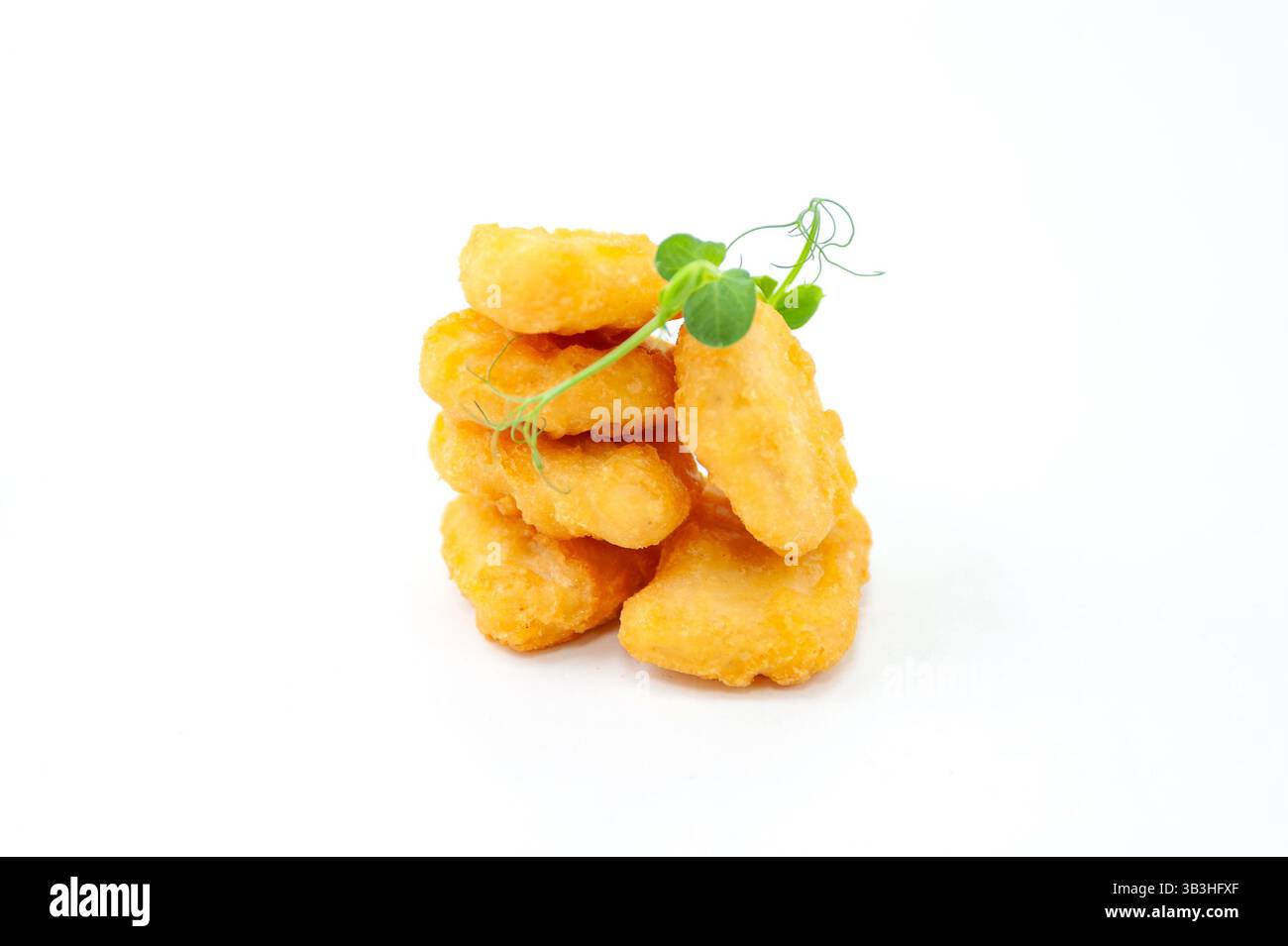Crispy Chicken Nuggets with Fresh Microgreens Stock Photo - Alamy