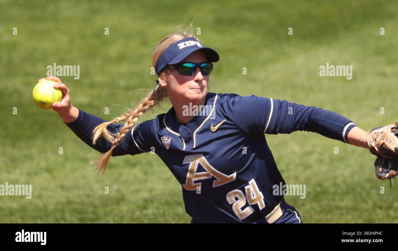 Akron's Delaney Jenkinson (24) throws the ball during an NCAA softball ...