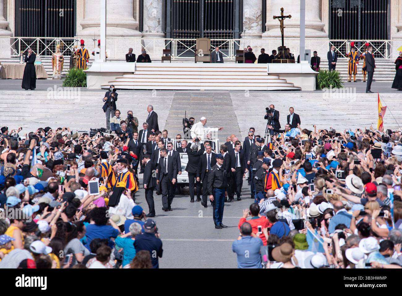Pope Francis waves to the crowd during his weekly general audience in ...