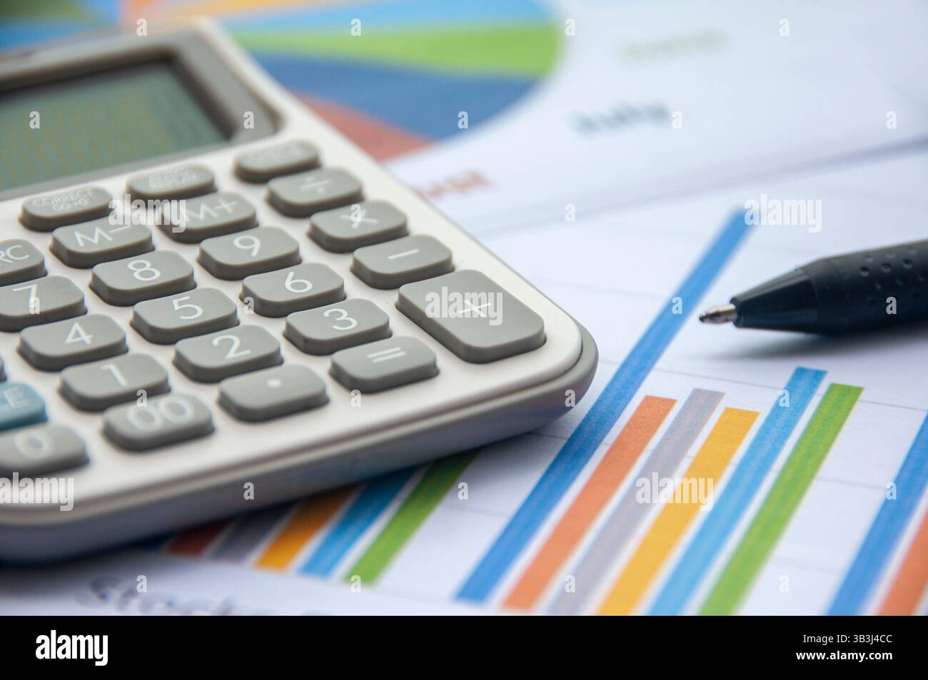 Graph analysis with calculator. Financial analysis concept Stock Photo ...